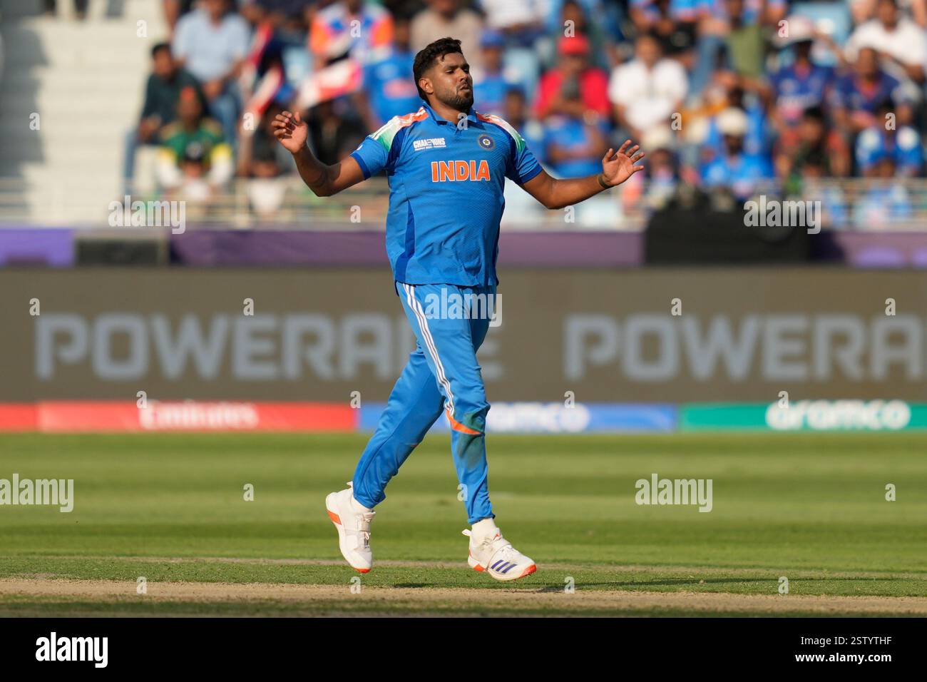 India's Harshit Rana reacts after bowling a delivery during the ICC ...