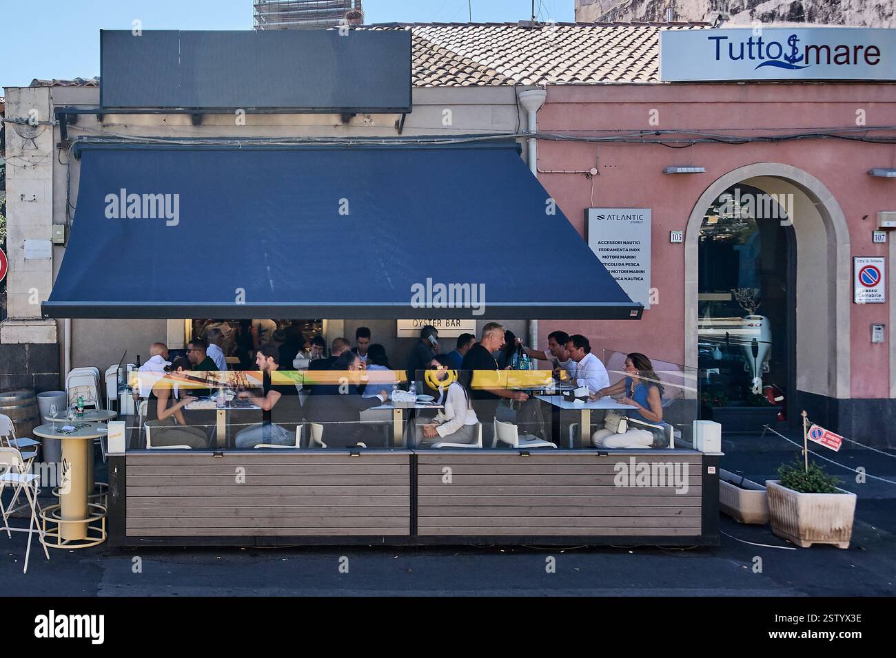 Catania, Italy - February 20, 2025: Lively dining scene at Tutto Mare ...
