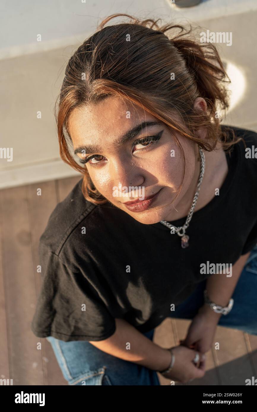 Portrait of a stylish young latin woman with modern makeup, wearing a ...