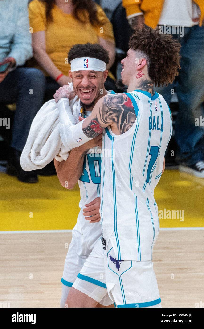 Charlotte Hornets' LaMelo Ball #1 celebrates with Seth Curry #30 after ...