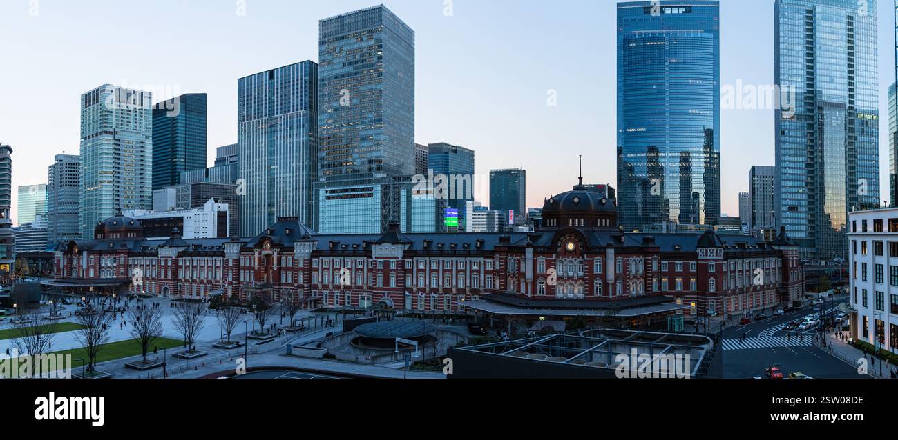 Tokyo station buildings made of red bricks and high-rise buildings as ...