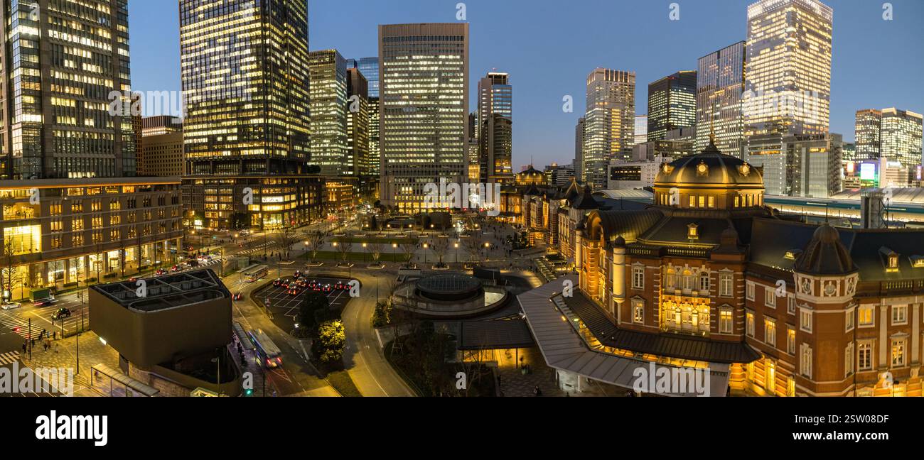 Night view of the Tokyo Station building and high-rise buildings made ...