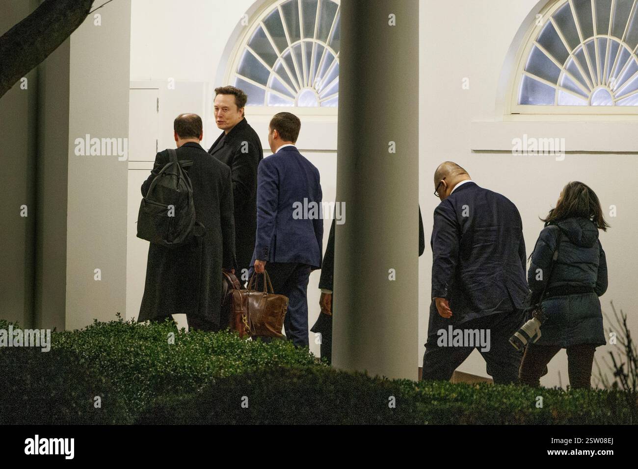 Elon Musk is seen with an Air Force One plush toy as he arrives at the ...