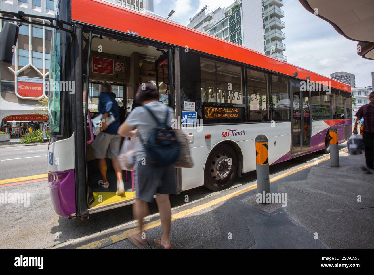 Public bus stop at a shelter station for passengers to embark ...