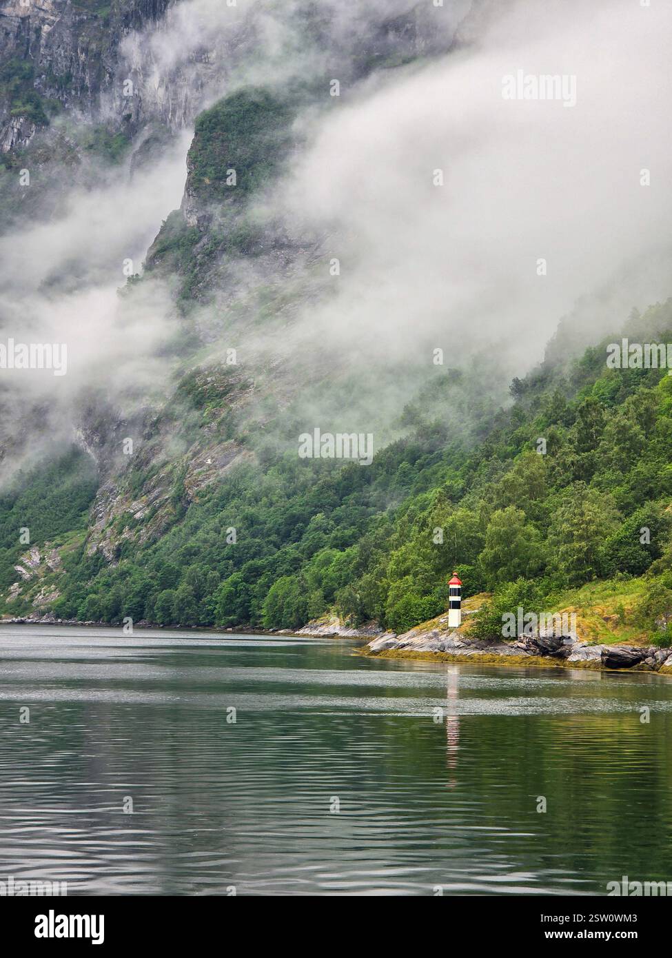 Misty Fjord Morning With Lighthouse in Norways Serene Landscape Stock ...