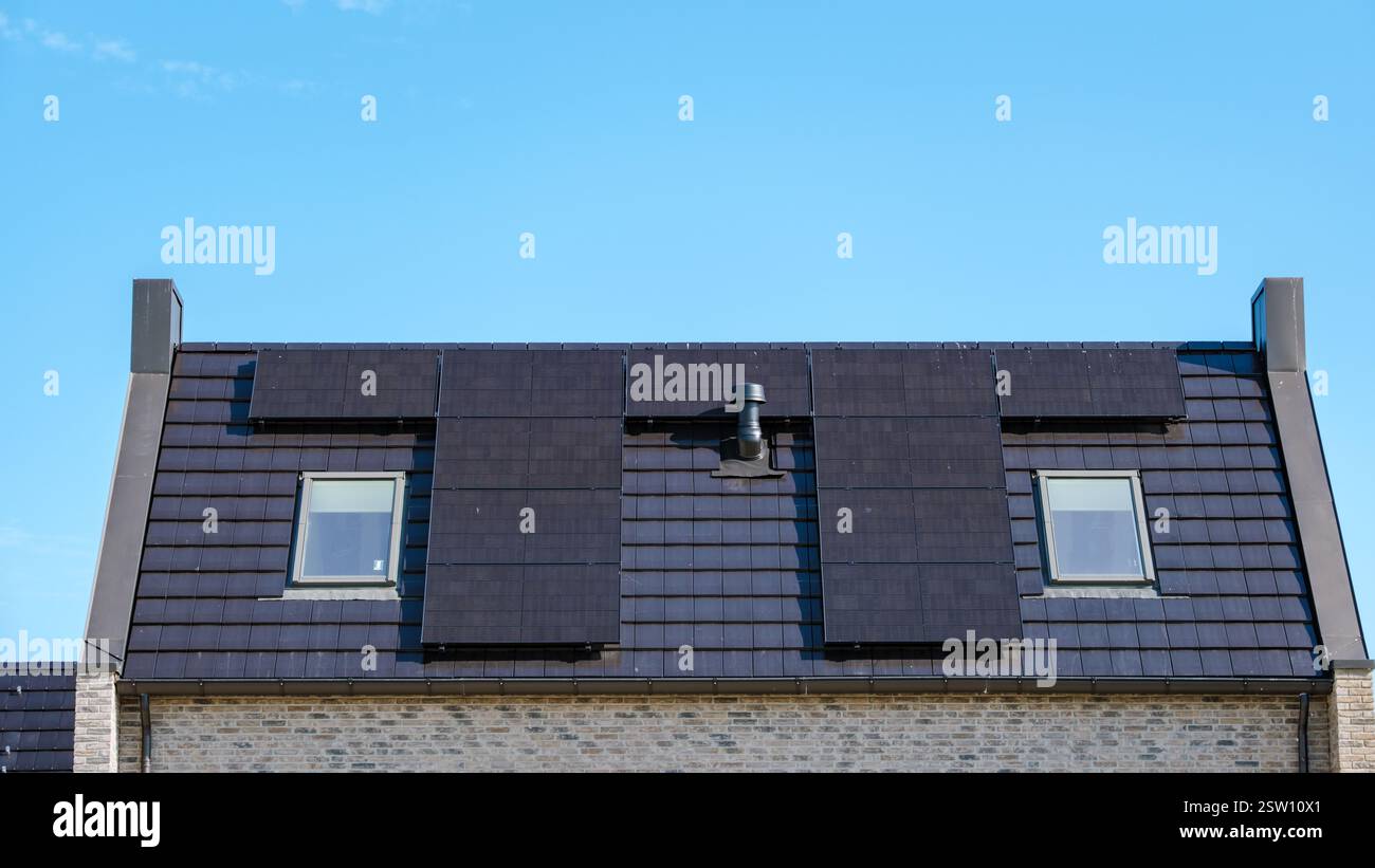 Solar panels elegantly positioned on a modern rooftop capture sunlight ...