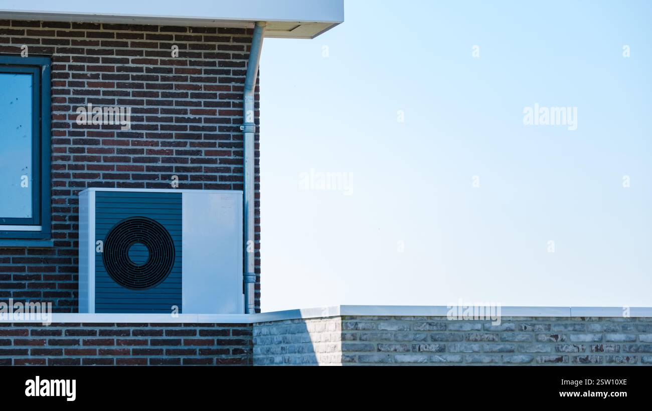 Air Source Heat Pump Installed on Modern Building Roof on a Sunny Day ...