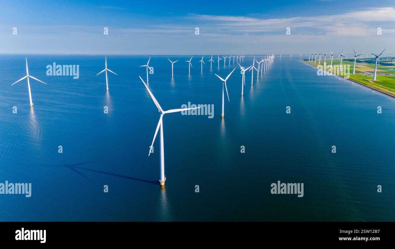 A stunning array of wind turbines stands tall over serene waters ...