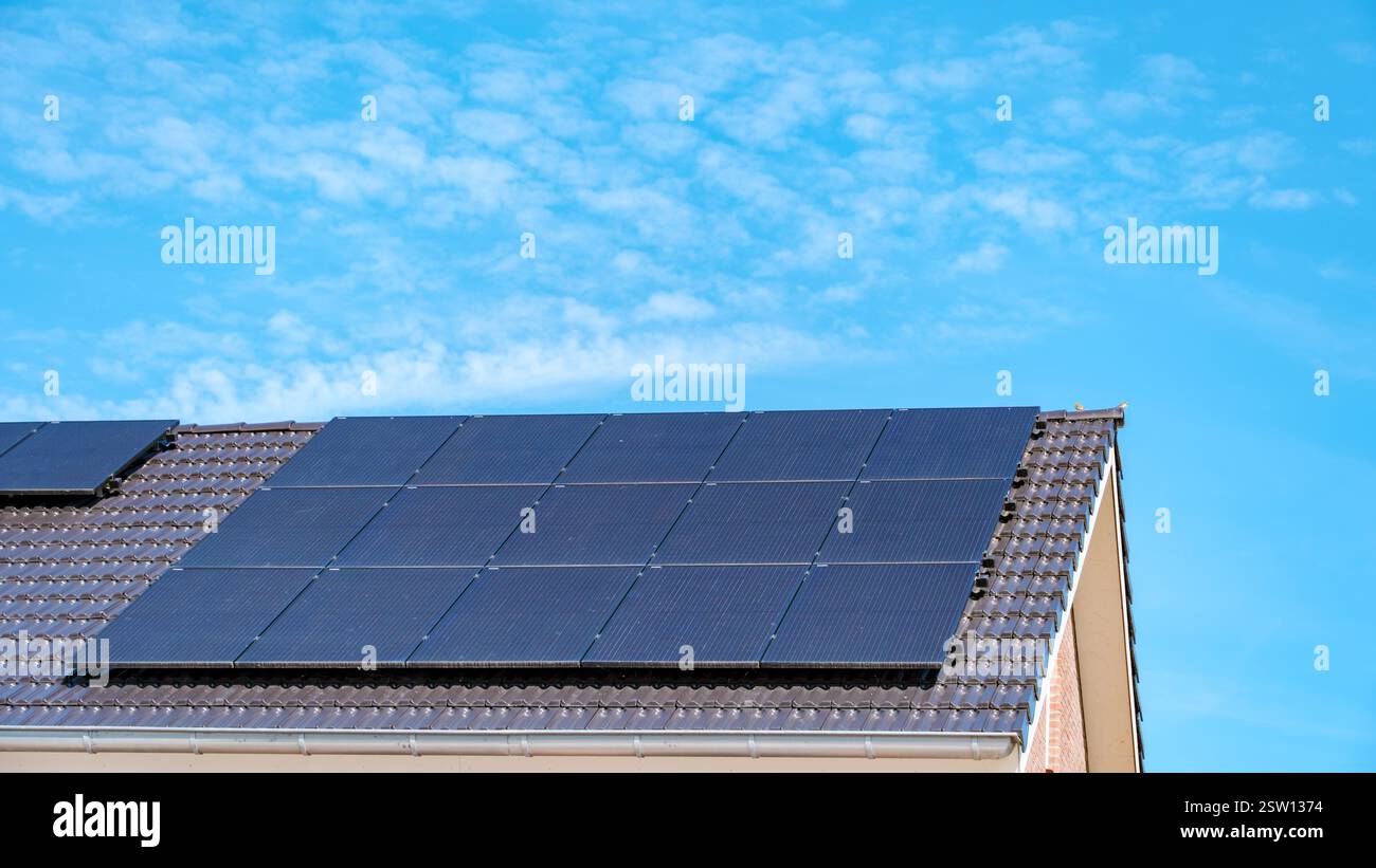 Solar panels catch sunlight on a rooftop hi-res stock photography and ...
