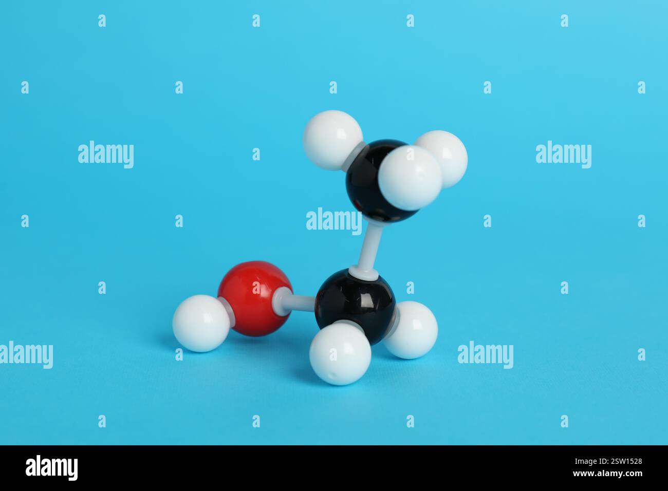 Molecule of ethanol on light blue background. Chemical model Stock ...