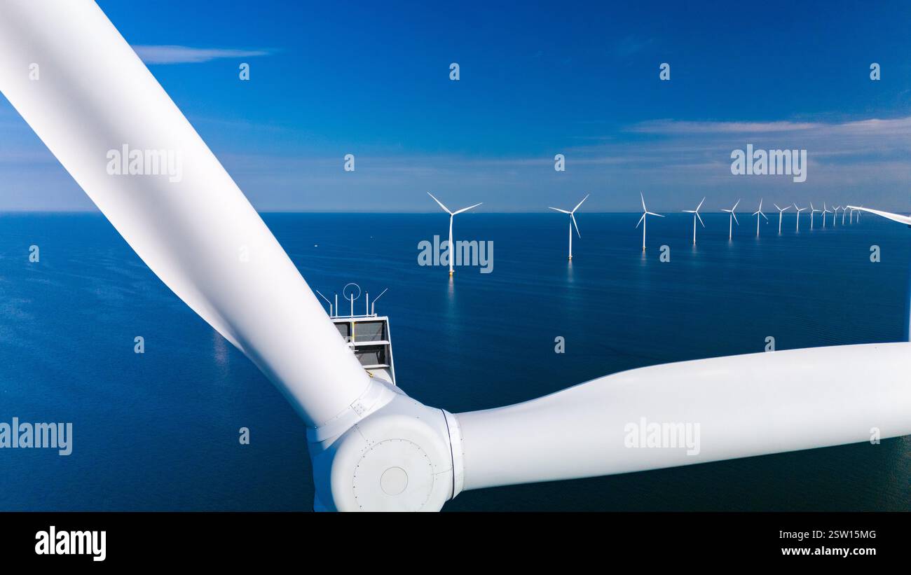 Wind Turbines Generating Renewable Energy Over Calm Waters in the ...
