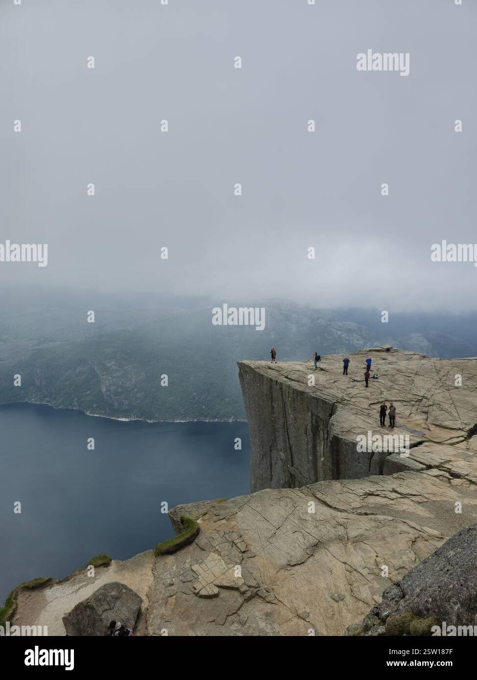 Jorpeland Norway 14 June 2024, Visitors stand on the edge of ...