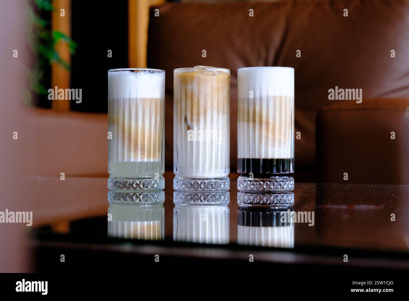 Three layered iced coffee drinks in elegant glasses Stock Photo - Alamy