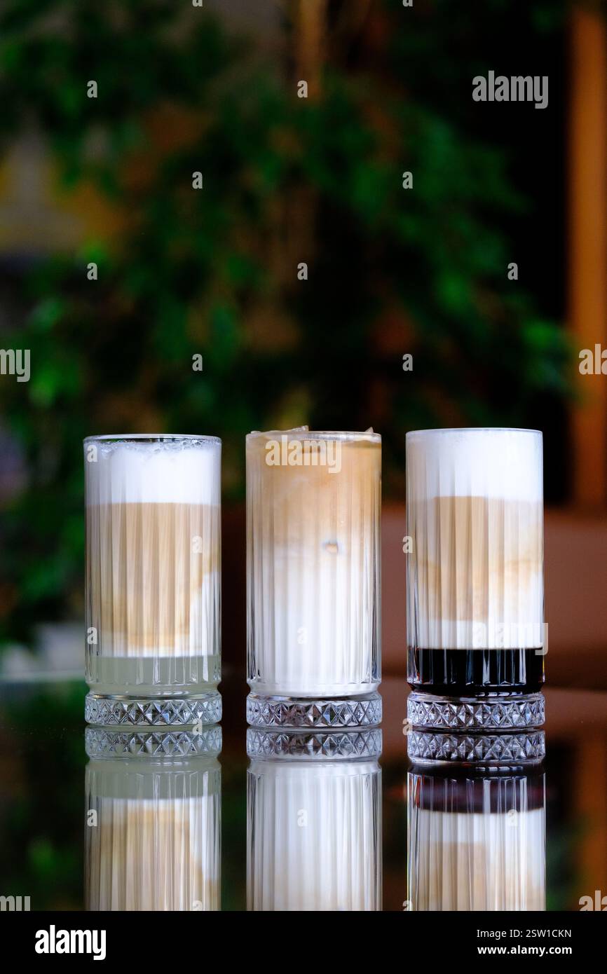 Three layered iced coffee drinks in elegant glasses Stock Photo - Alamy
