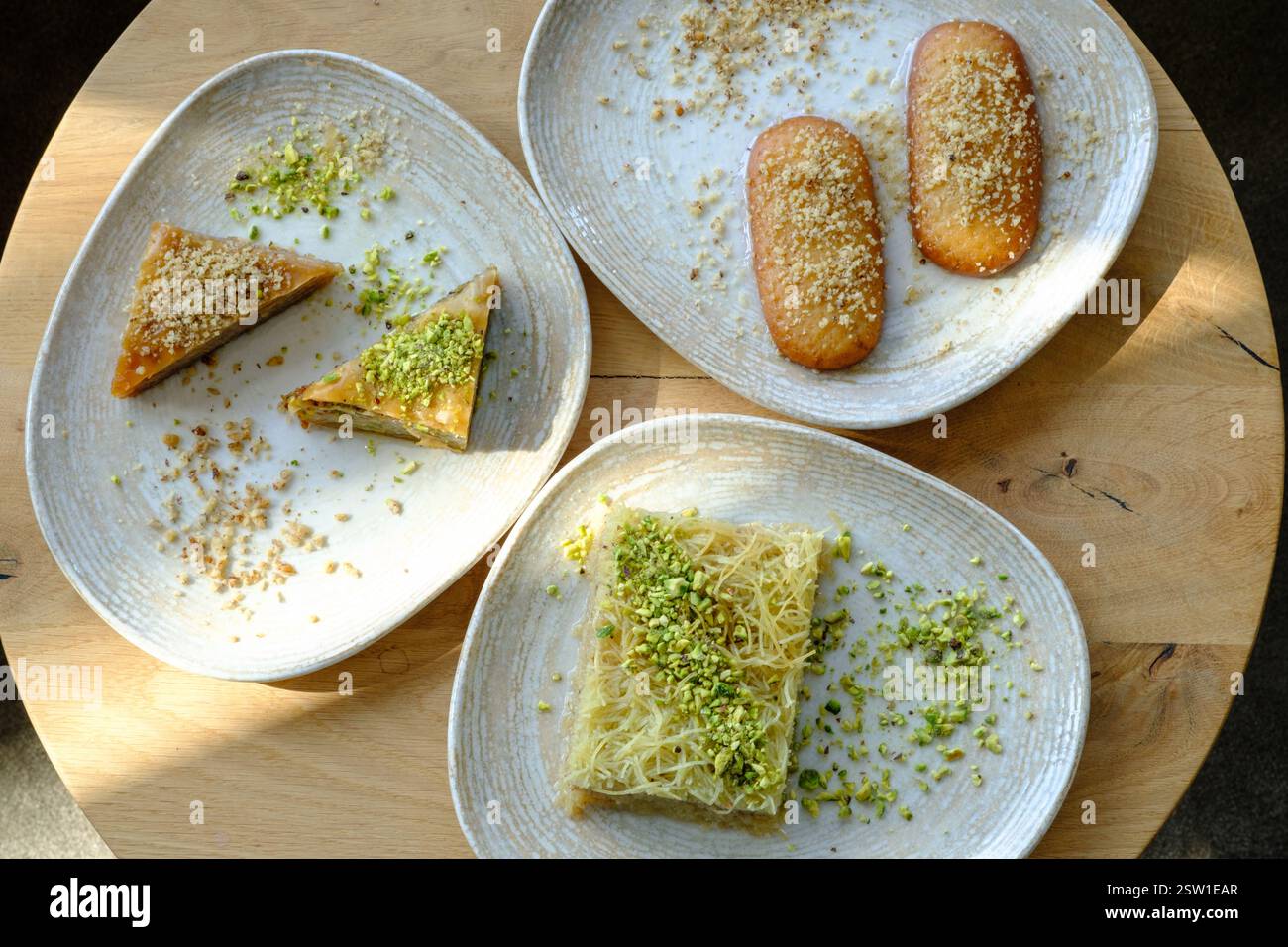 Assorted pastries: baklava knafeh and small cookies garnished with ...
