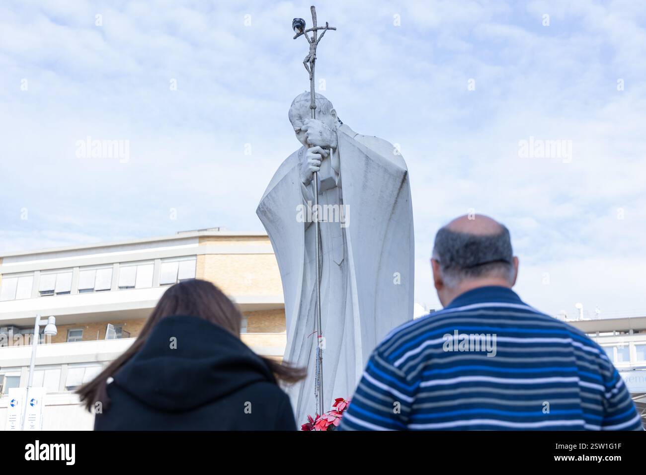 Rome, Italy. 20th Feb, 2025. Faithful pray for Pope Francis under the ...