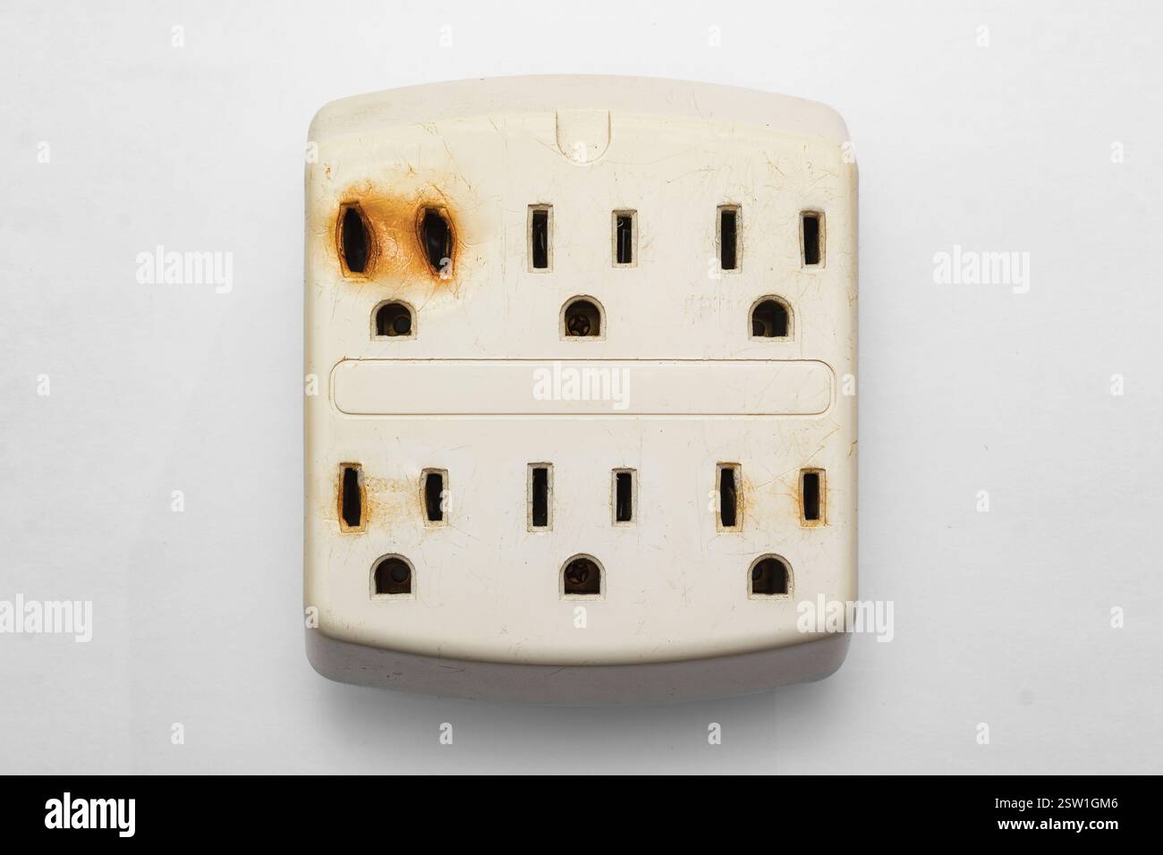 Burnt electrical wall outlet or plug Stock Photo - Alamy