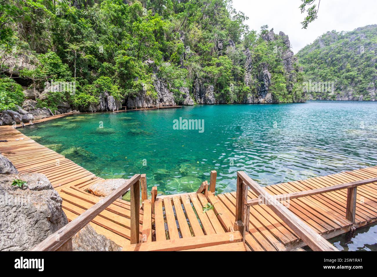 Kayangan Lake ringed by towering cliffs is a popular tourist ...