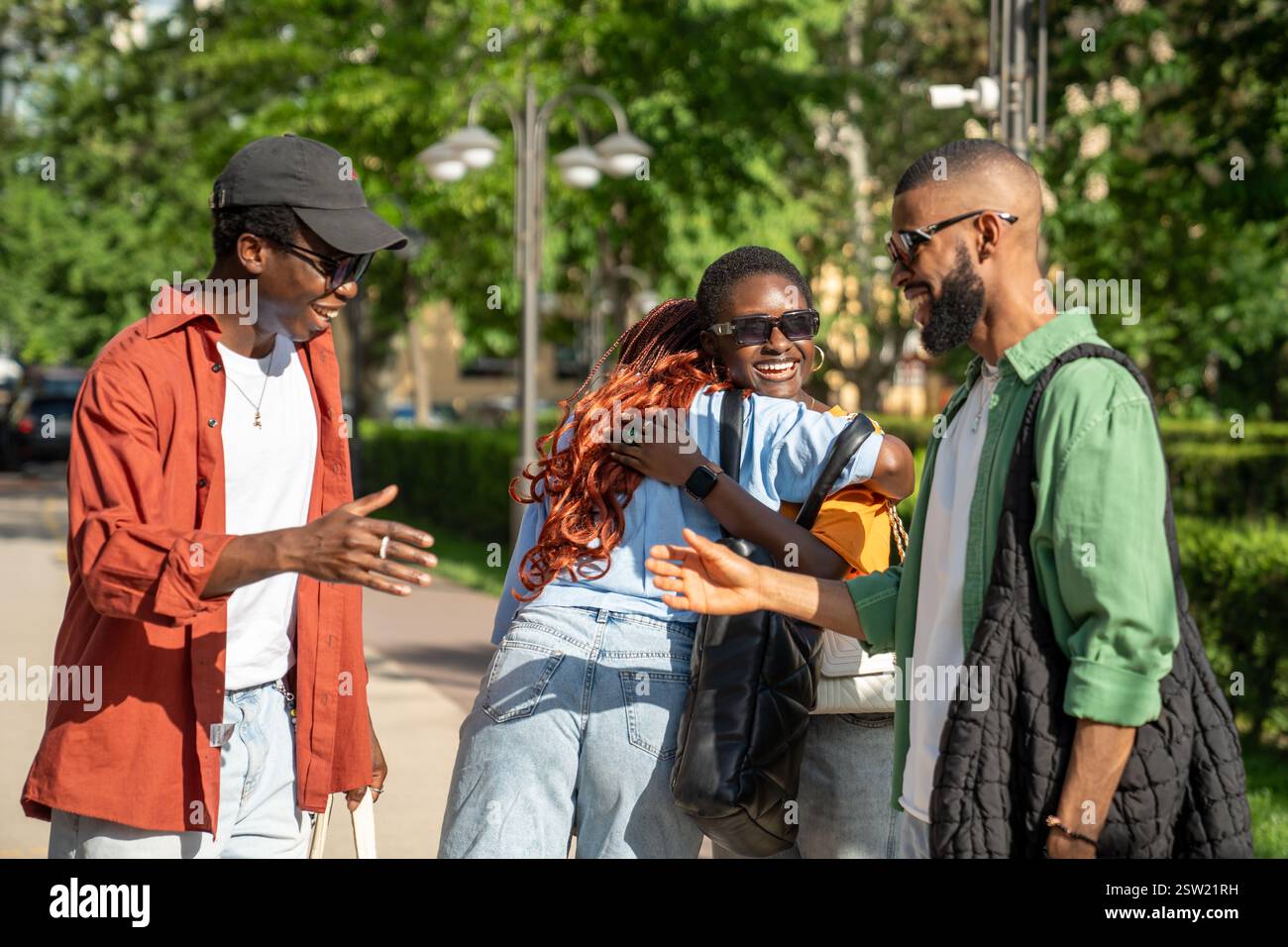 Happy bunch of friends students share smiles hugs handshakes come ...