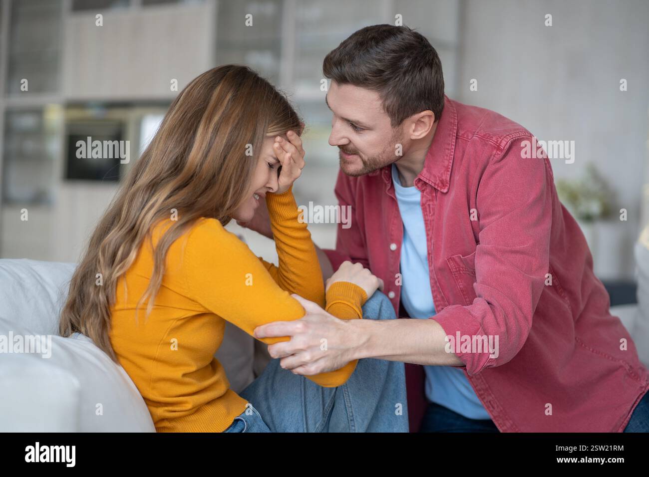 Angry man roughly holds crying girl hands, aggressively explaining ...