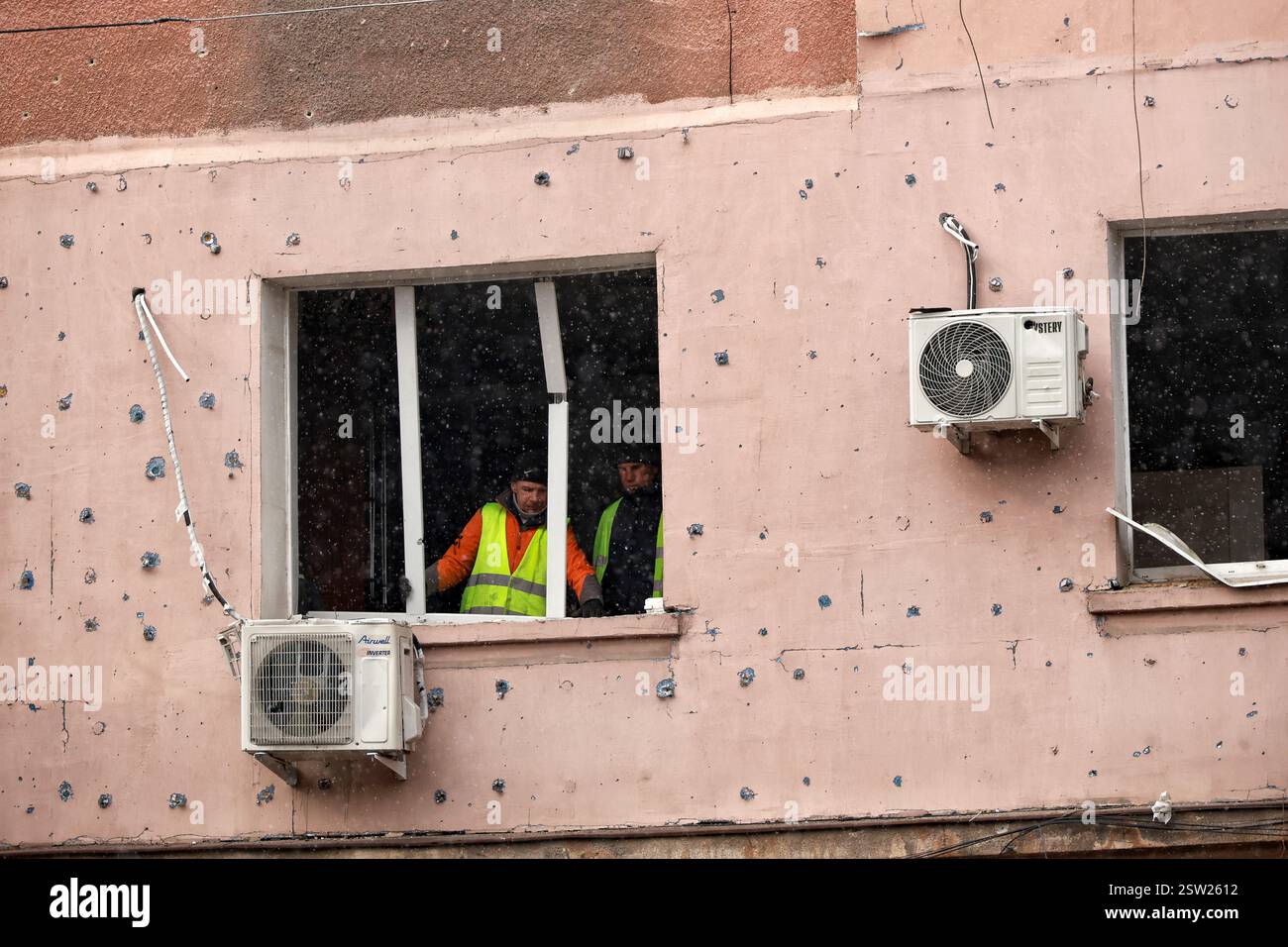 ODESA, UKRAINE - FEBRUARY 20, 2025 - Municipal workers repair a window ...