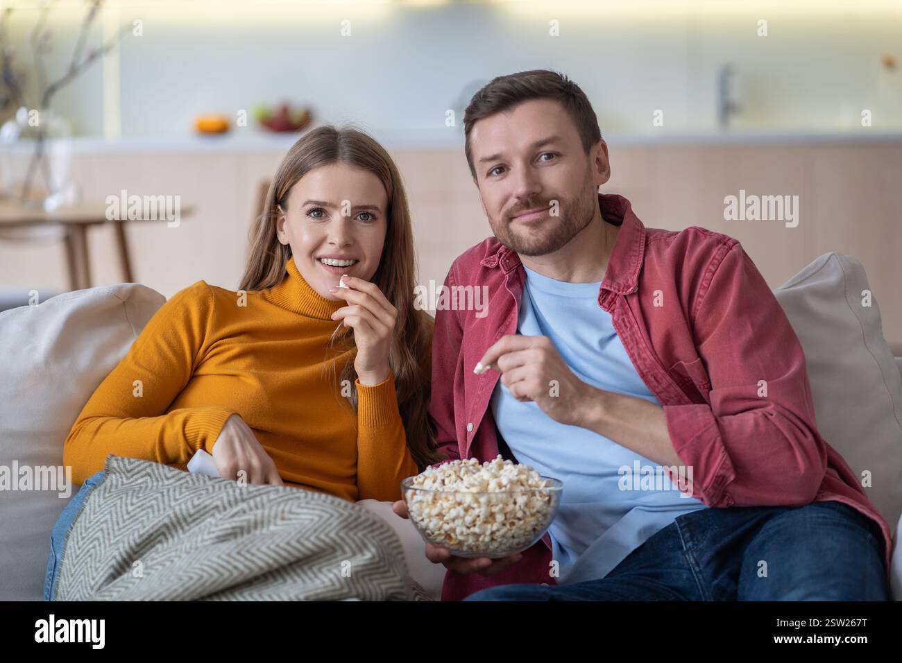 Happy woman home watching movie hi-res stock photography and images - Alamy