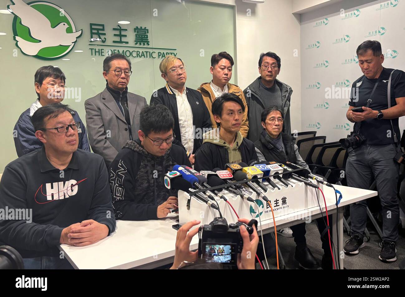 Lo Kin-hei, chairperson of Hong Kong's Democratic Party, seated, second ...