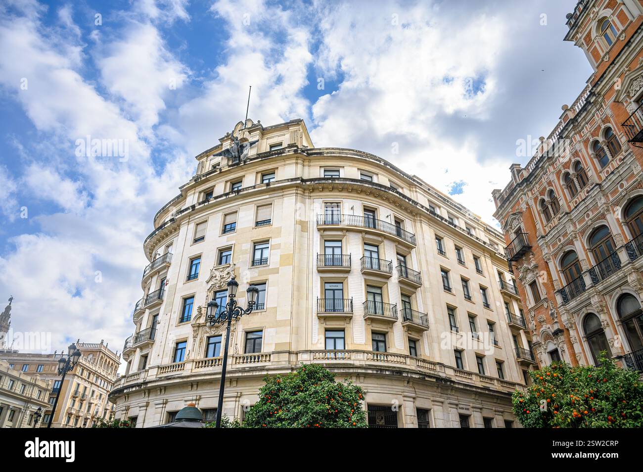 Facade of the building La Union y El Fenix, Seville, Spain Stock Photo ...