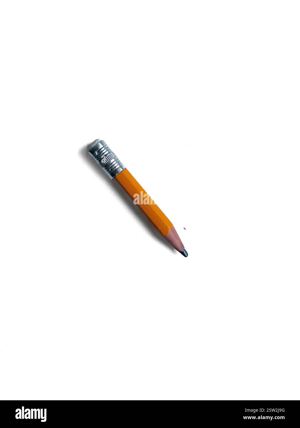 A pencil with a silver eraser on the end. The eraser is slightly larger ...