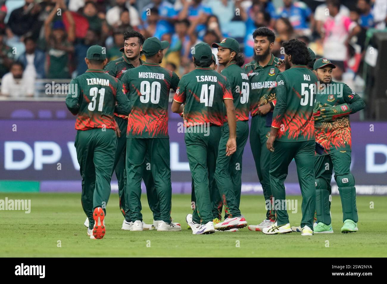 Bangladesh's Taskin Ahmed, second left, celebrates with teammates after ...