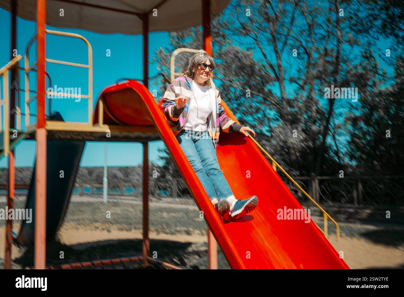 Elderly caucasian woman slides hi-res stock photography and images - Alamy