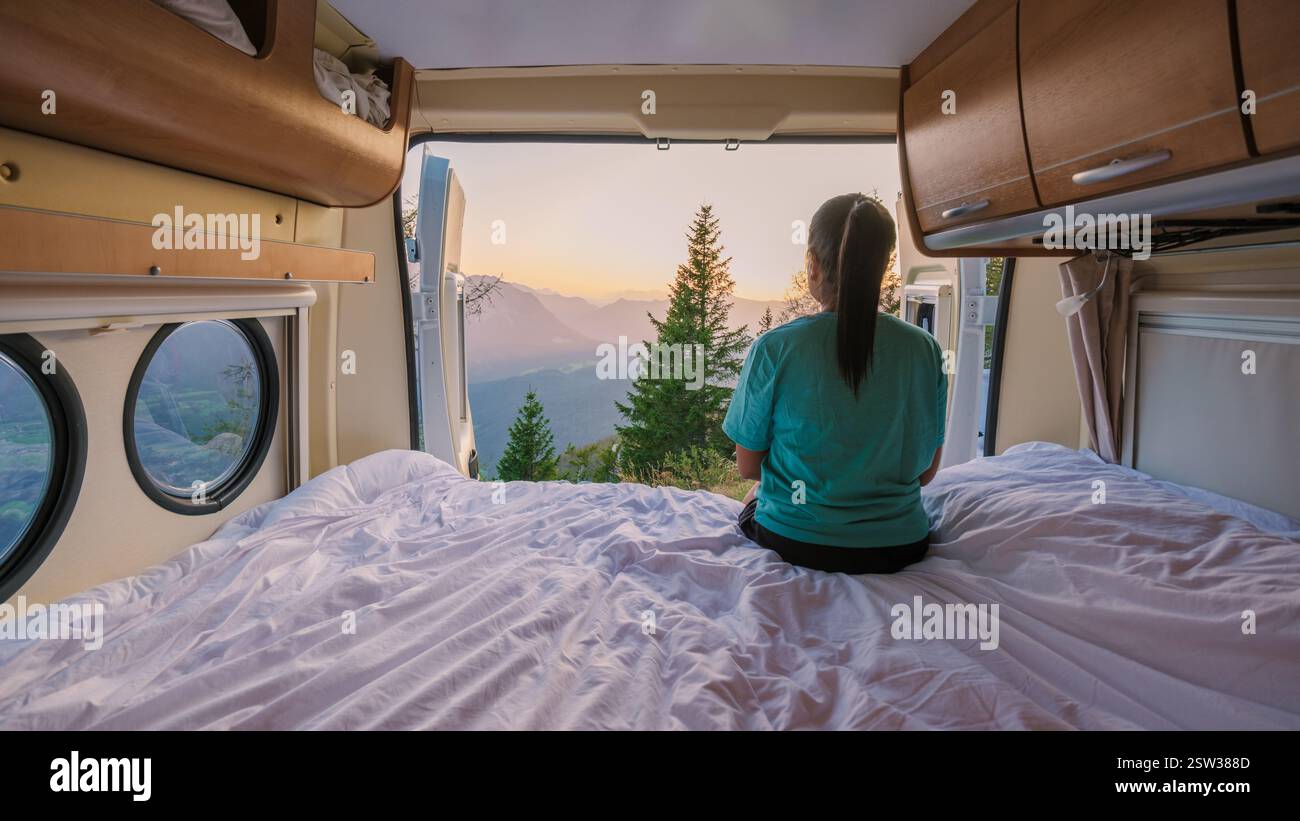 Nestled in a cozy camper, a person enjoys a peaceful morning as ...