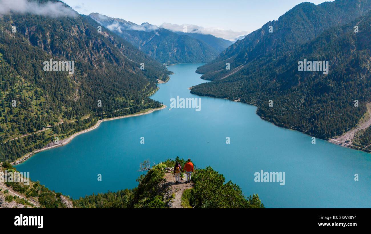 Explore the breathtaking beauty of Plansee Lake in Austria surrounded ...