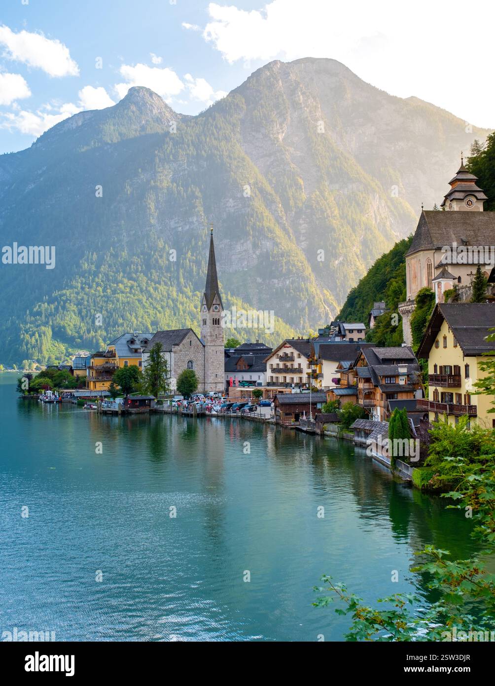 Serene summer afternoon in Hallstatt, Austria with stunning lakeside ...