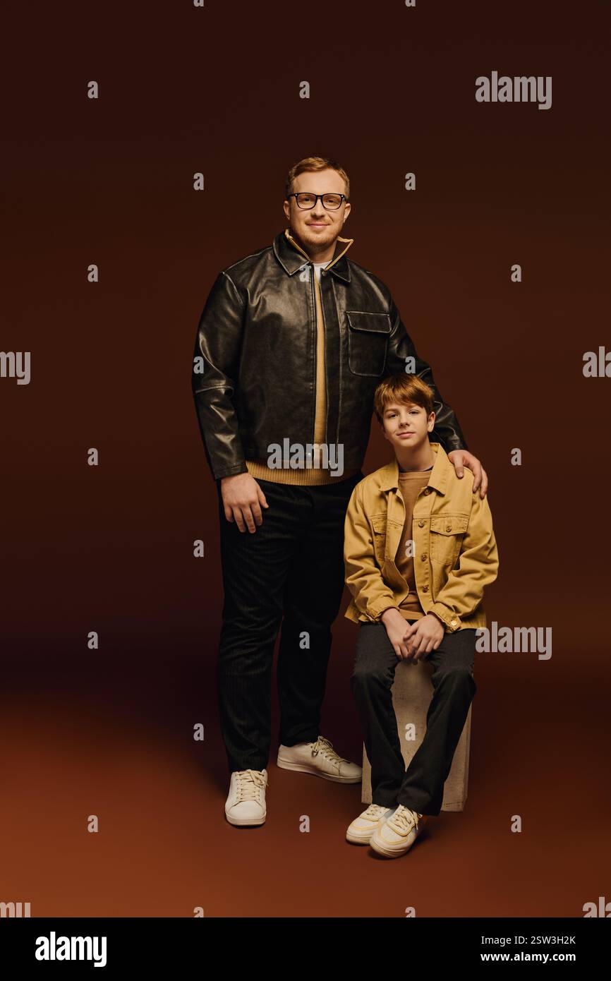 Father and son showcase their casual fashion while smiling together in ...