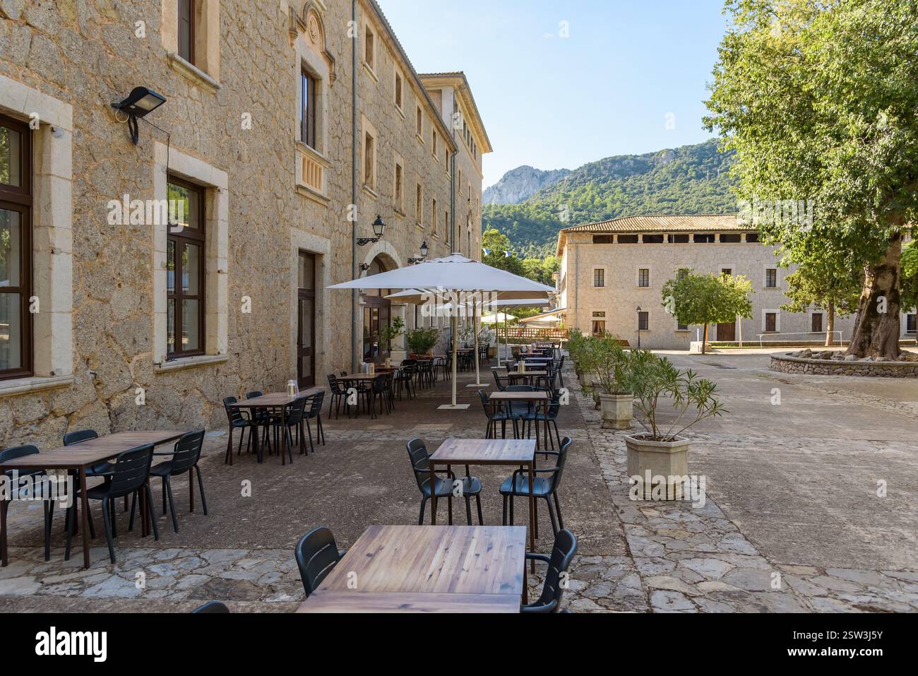 A peaceful courtyard at the Lluc sanctuary in Mallorca, featuring ...