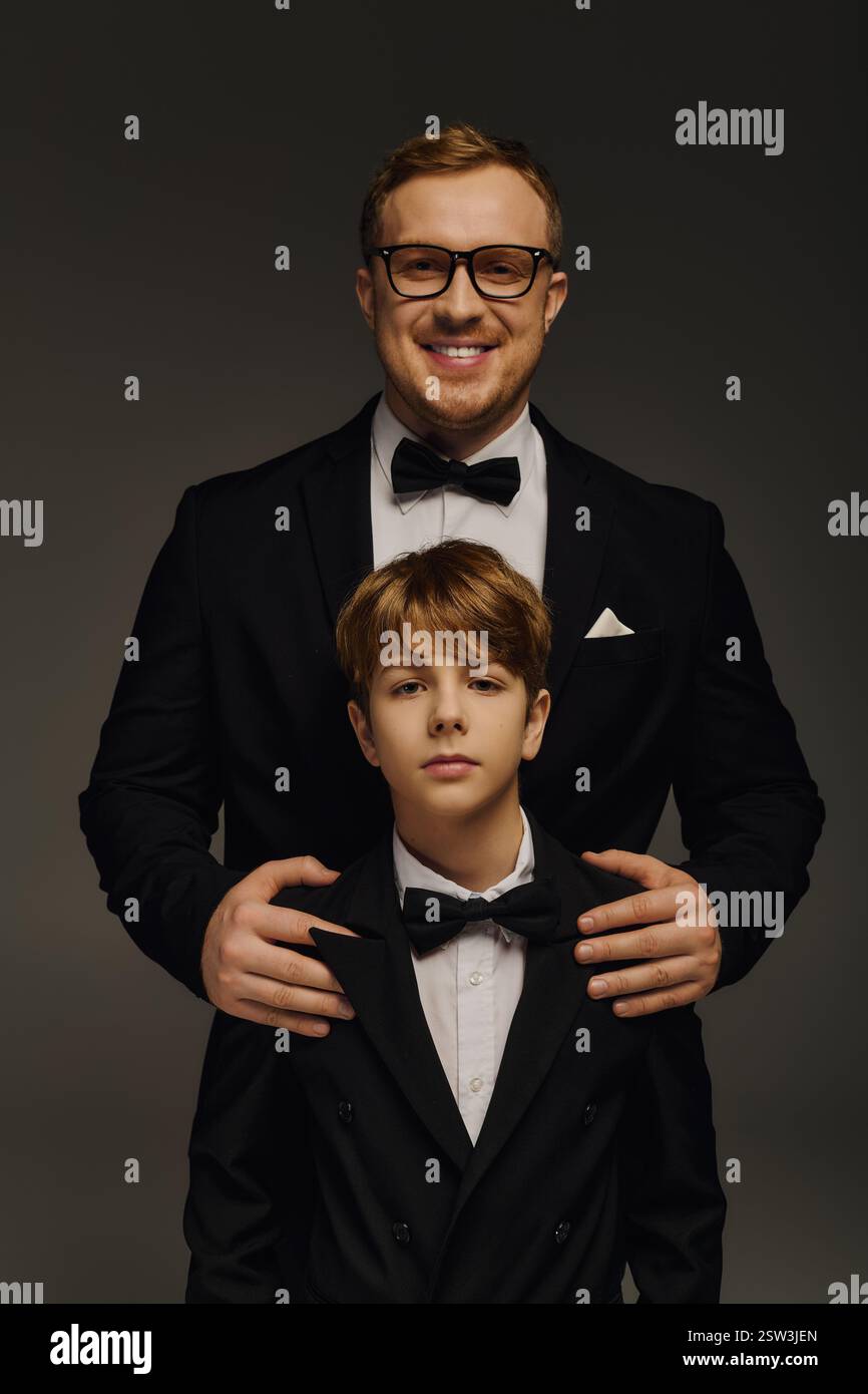 Two dapper individuals dressed in matching tuxedos pose confidently ...