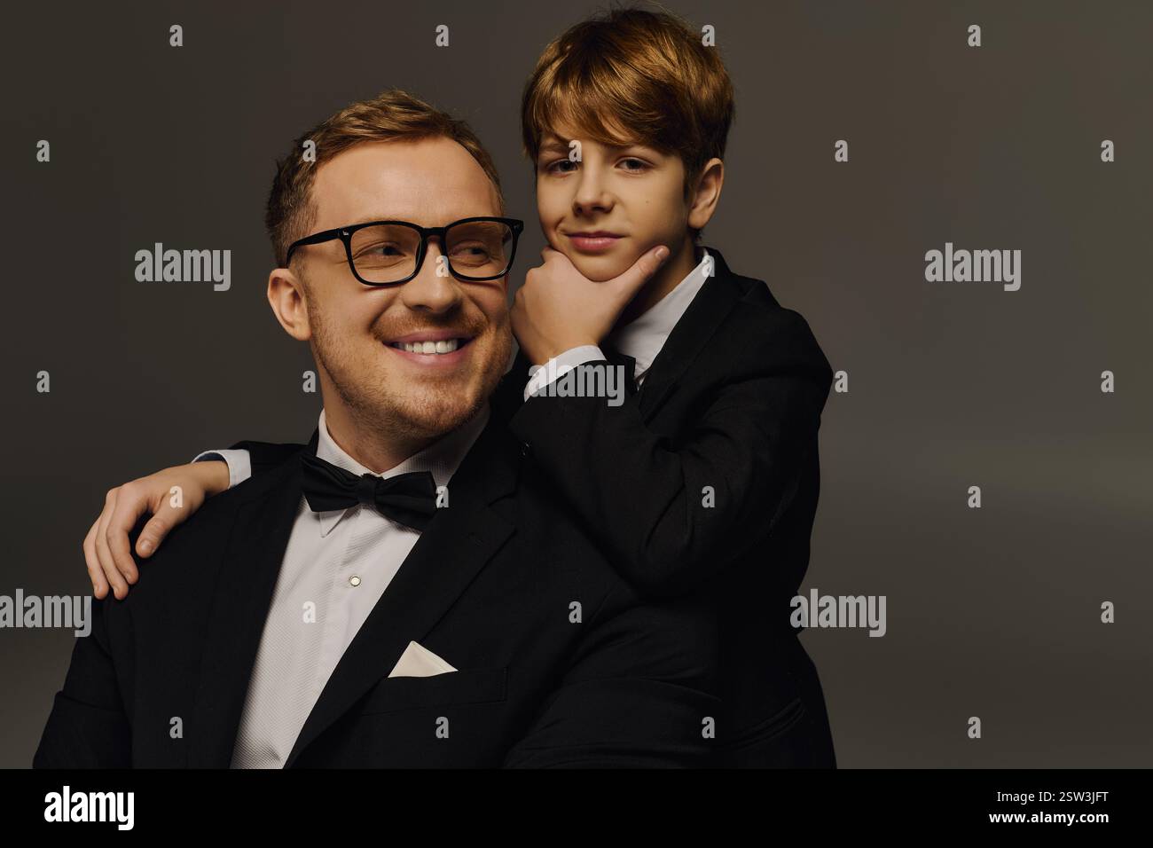 A chic father and son duo display refined fashion in stunning tuxedos ...