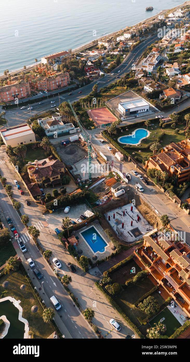 Aerial view of coastal urban development with pools and roads near the ...