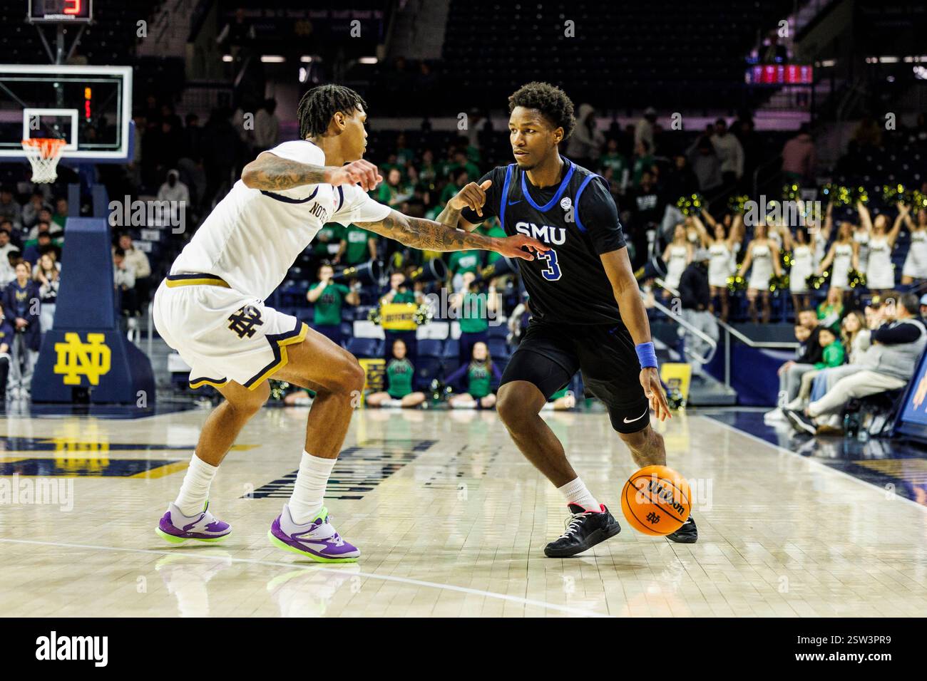February 19, 2025: SMU guard Chuck Harris (3) drives as Notre Dame ...