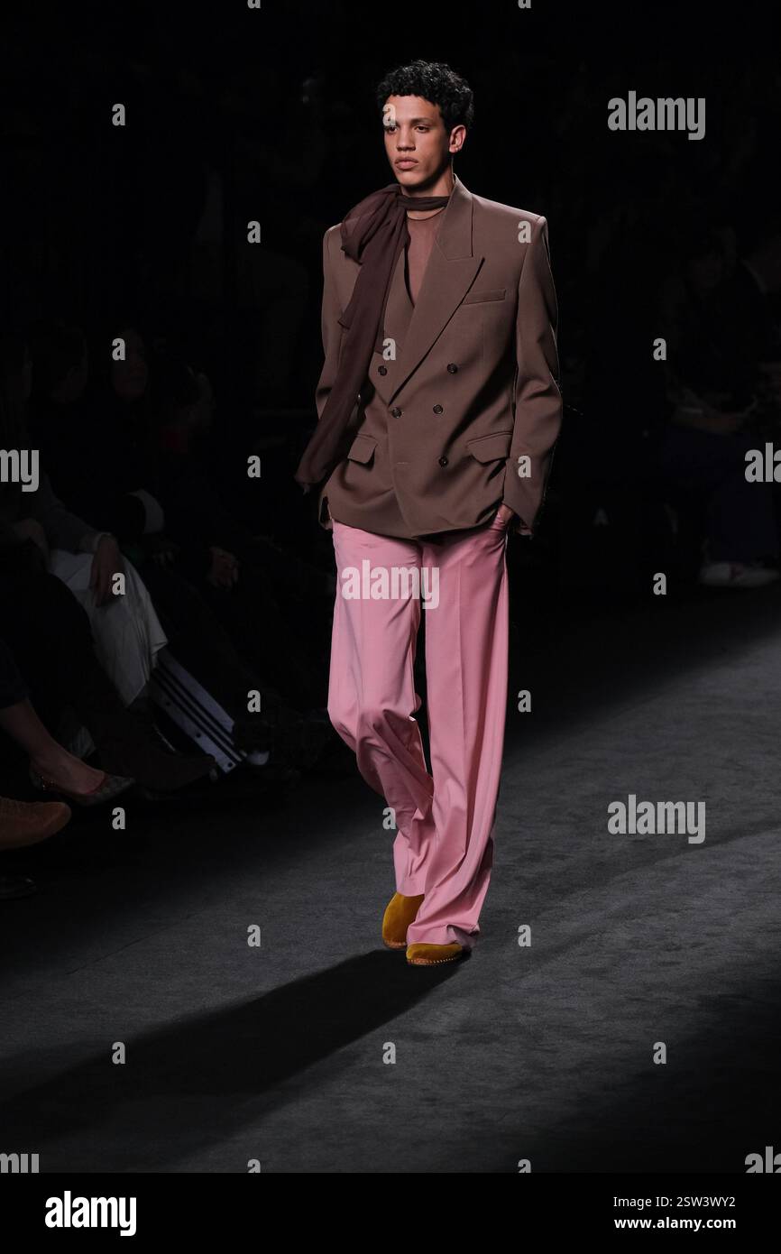 A model walks the runway wearing a design by Mans during Mercedes-Benz ...