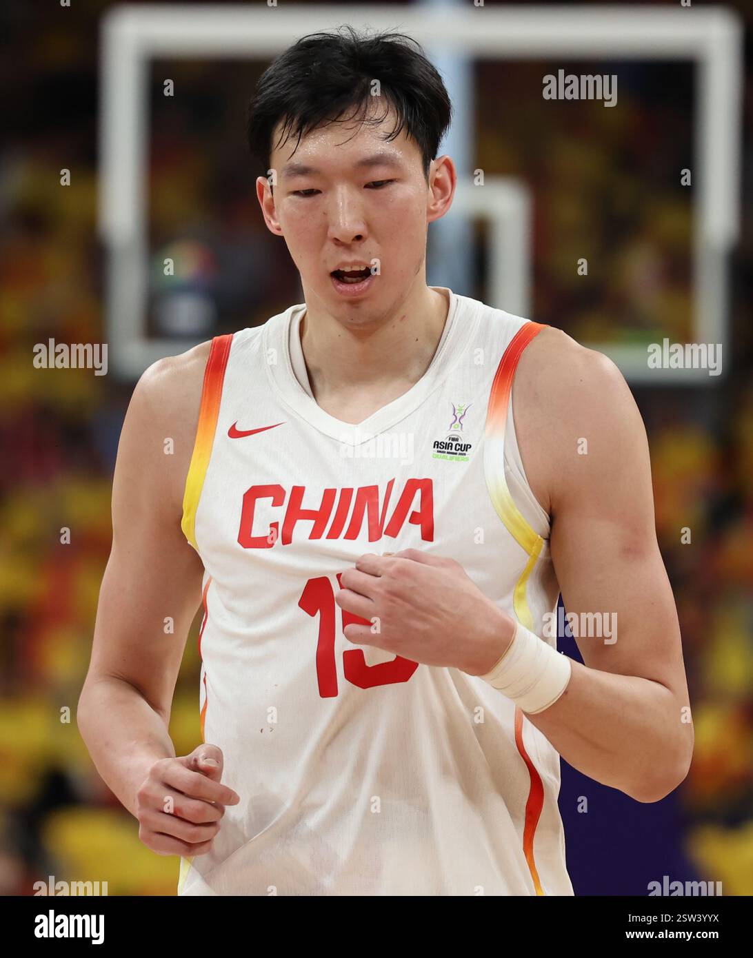 Shenzhen, China's Guangdong Province. 20th Feb, 2025. Zhou Qi of China reacts during the FIBA ...