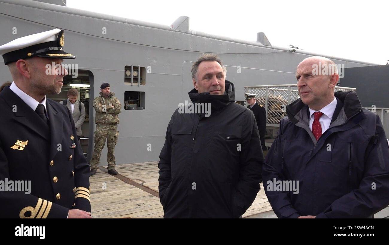 Screen grab taken from PA Video of Defence Secretary John Healey (right ...