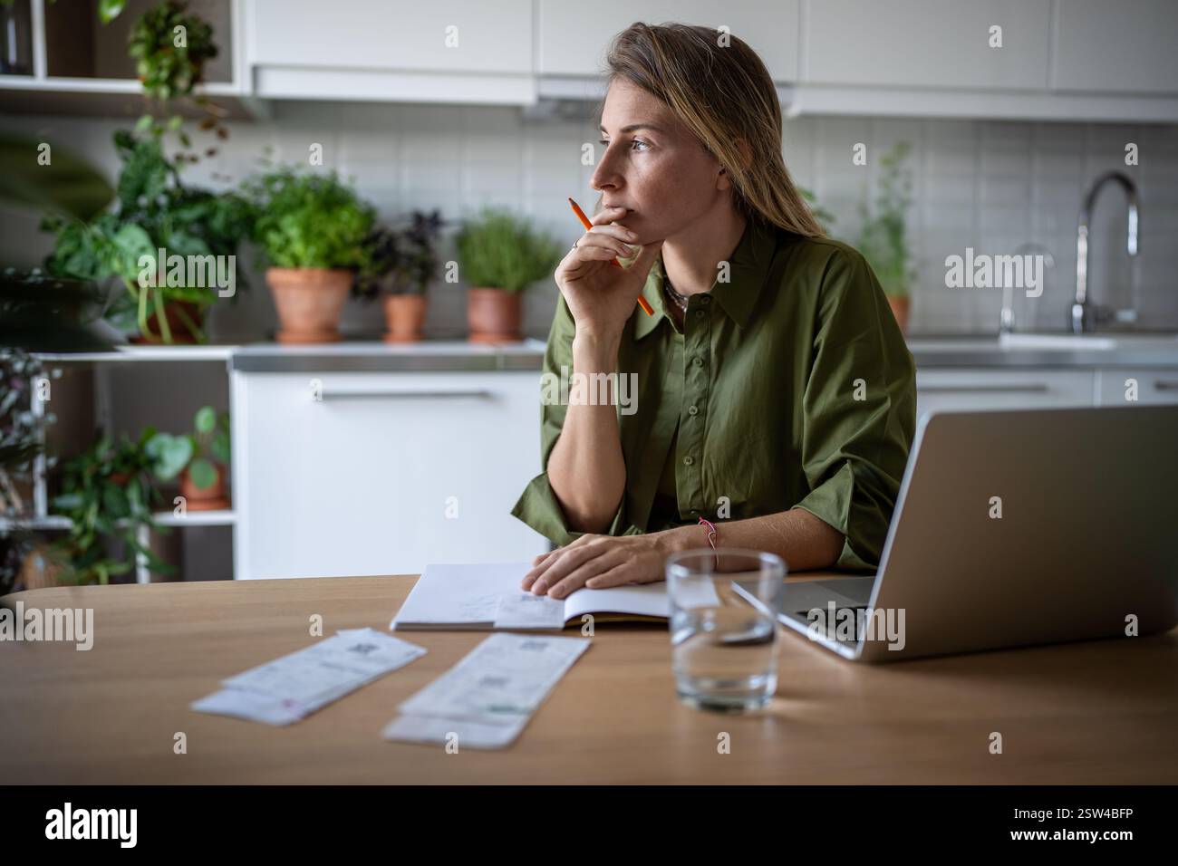 Female accountant freelancer working at home analysing company budget ...
