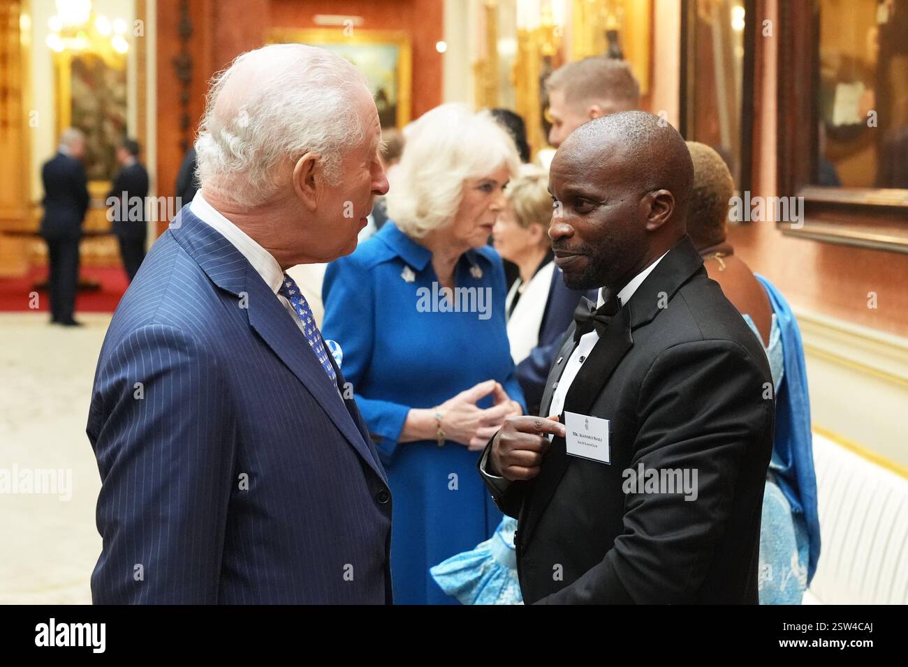 King Charles III meets Aloysius Ssali, founder of Say It Loud Club ...