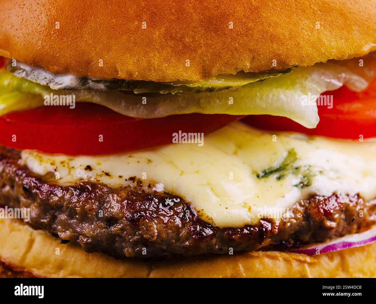 Delicious cheeseburger close up background Stock Photo - Alamy