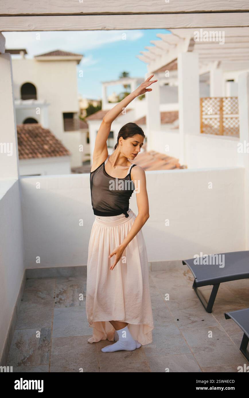 An Elegant Dance Pose Was Beautifully Captured on a Balcony With an ...
