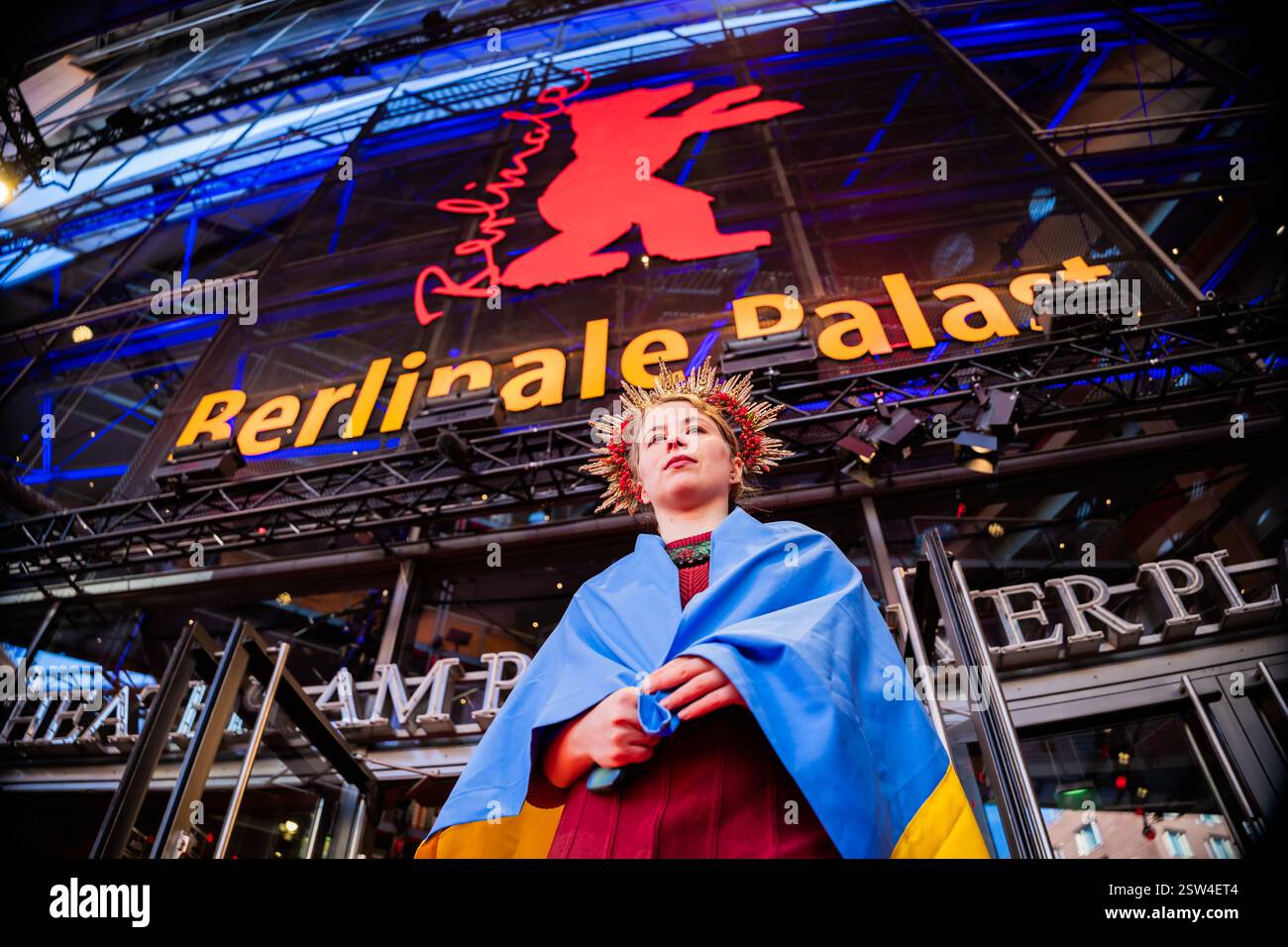 Berlin, Germany. 20th Feb, 2025. Slavia, visitor, stands with headdress ...