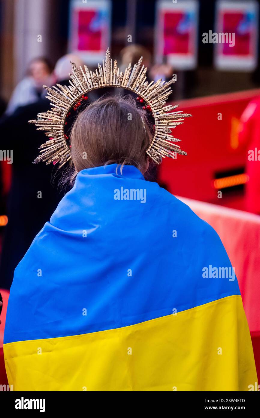 Berlin, Germany. 20th Feb, 2025. Slavia, visitor, stands with headdress ...