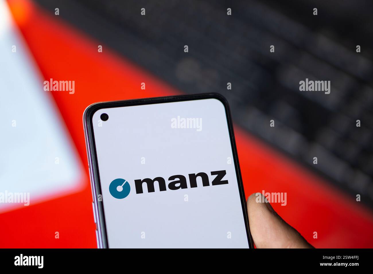 Dhaka, Bangladesh- 23 Sep 2024:Manz logo is displayed on smartphone ...